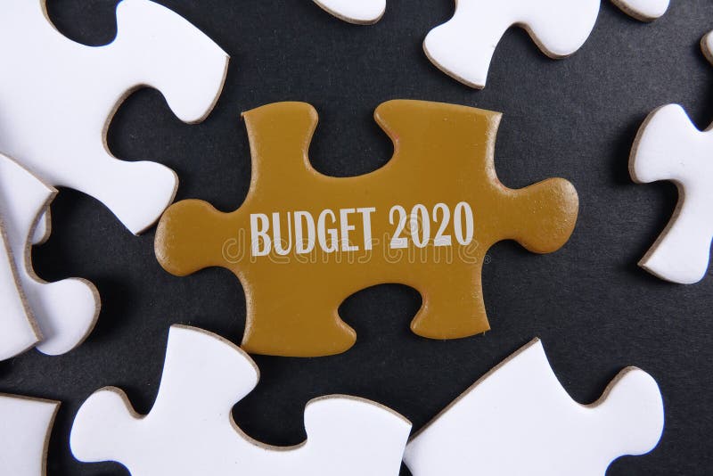 Budget 2020 Printed on Gold Puzzle Over White Puzzle Background. Stock ...
