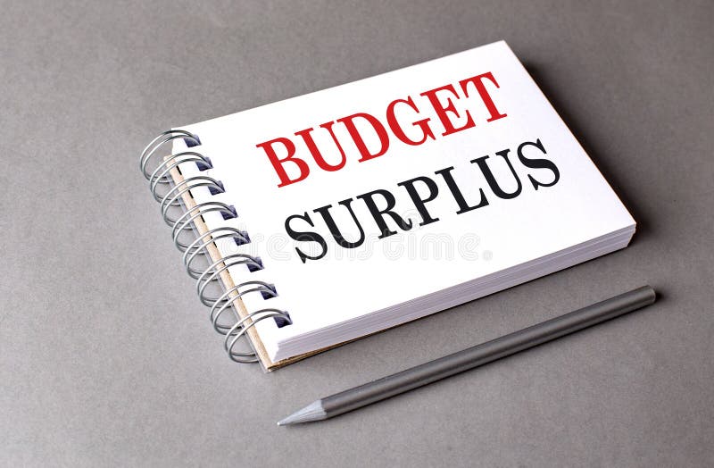 BUDGET SURPLUS Text on Notebook on Grey Background Stock Image - Image ...