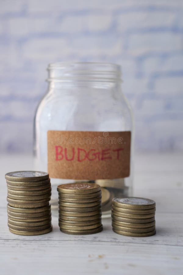 Budget Text on a Saving Coins Jar on White Stock Photo - Image of text ...
