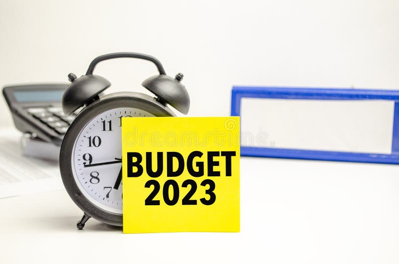 BUDGET 2023 Yellow Card with Alarm Clock and Calculator Stock Image ...