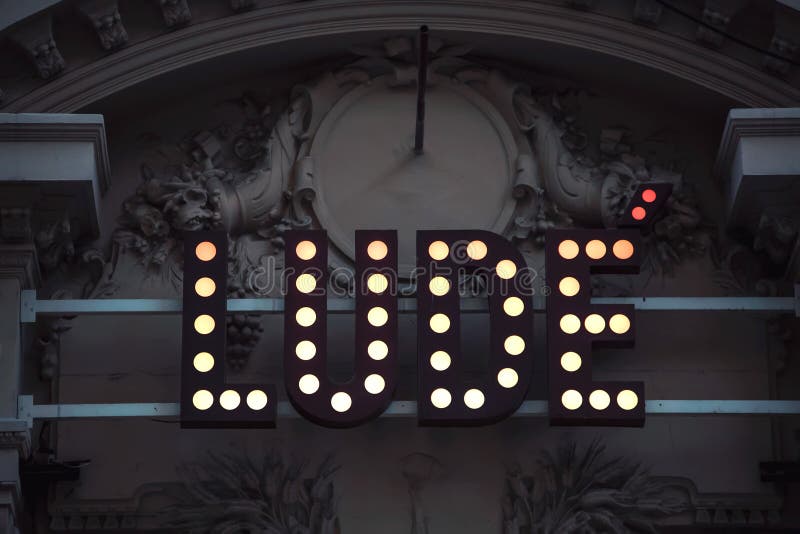 Front View of a Sign "Lude" from Led Lights in Front of an Old Building ...
