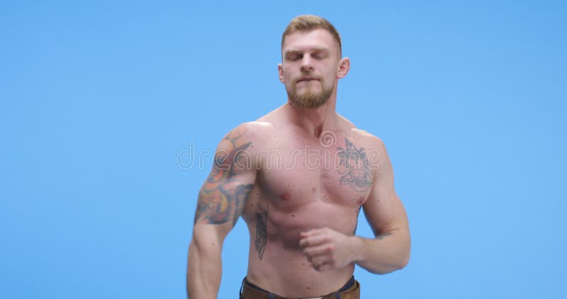 Buff man flexing his arms stock video. Video of cool - 166336357