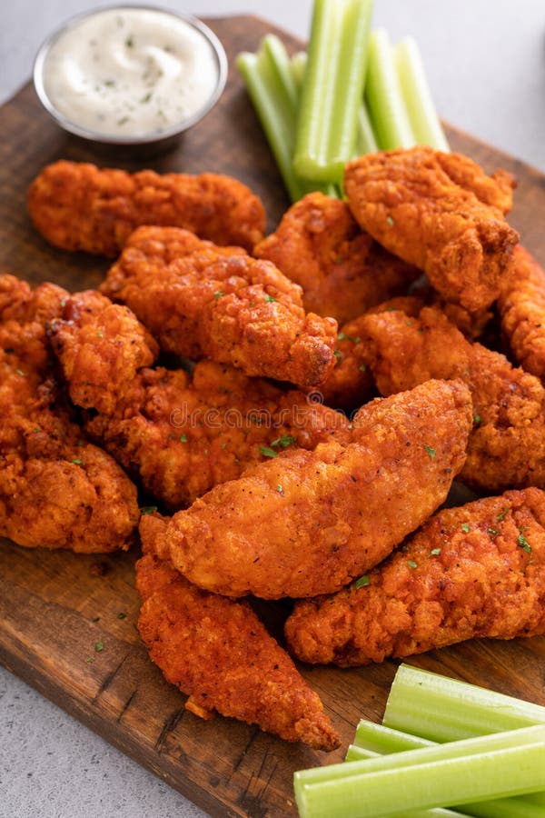 Buffalo Chicken Strips on a Board with Ranch and Celery Stock Image ...