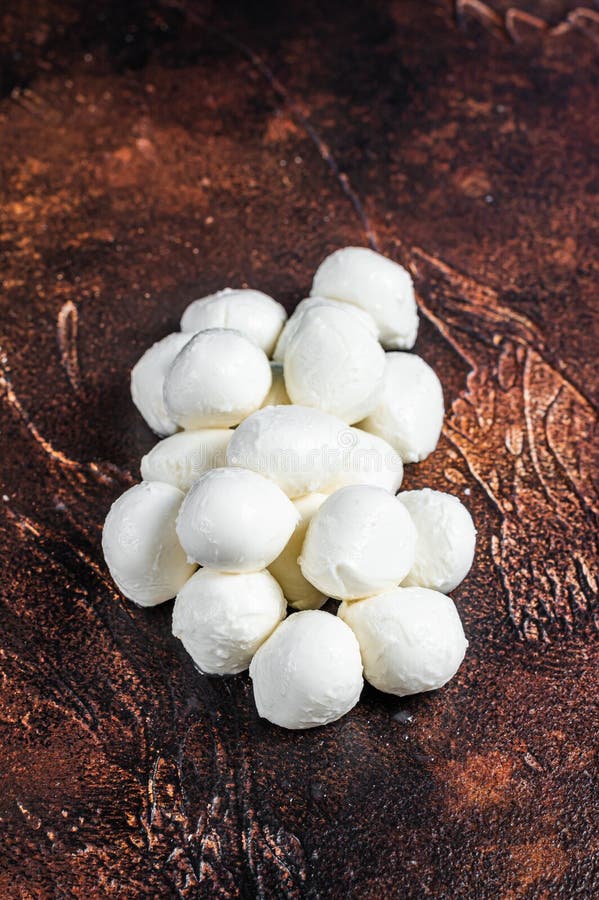 Buffalo Mozzarella Cheese Mini Balls on Kitchen Table. Dark Background ...