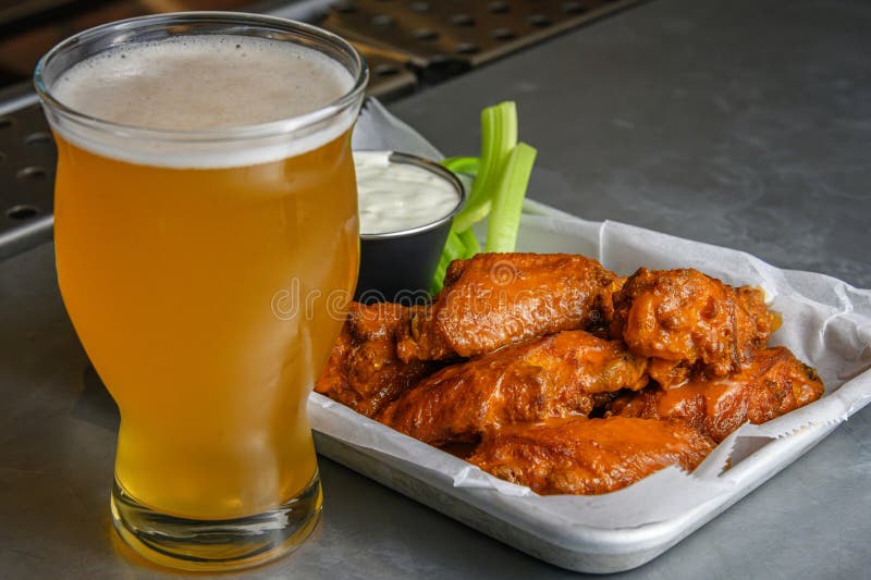 Buffalo Style Chicken Wings and a Draft Beer Stock Image - Image of ...
