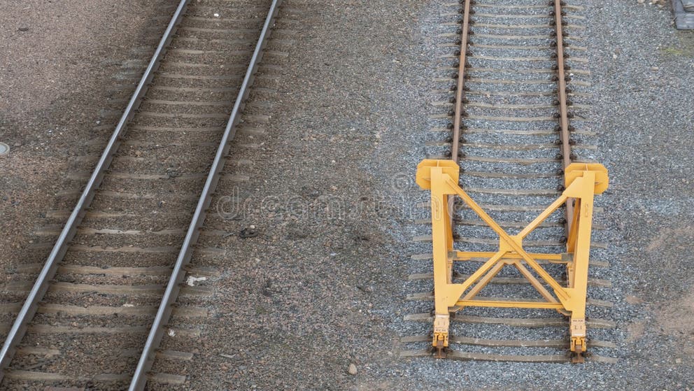 A Buffer Stop at the End of the Train Track. Stock Photo - Image of ...