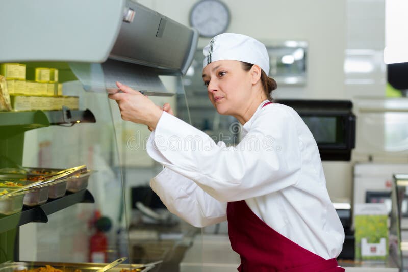 Buffet Female Worker Servicing Food in Cafeteria Stock Photo - Image of ...
