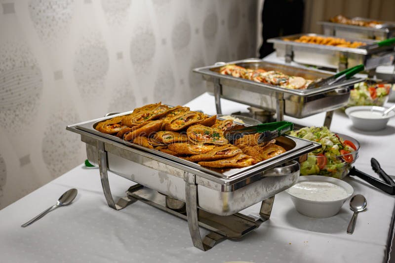 Buffet Full of Different Dishes Such As Salads and Cutlets on Metal ...