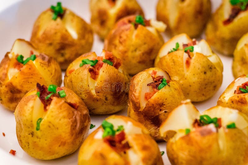 A Buffet Offering of Baked Baby Potatoes Served with Bacon Bits and ...