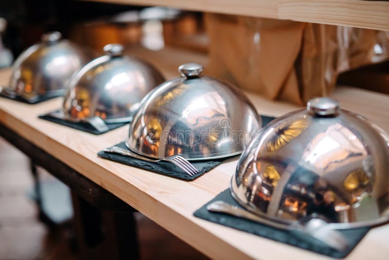 Buffet in a Restaurant or Hotel. Metal Dishes with Caps. Stock Photo ...
