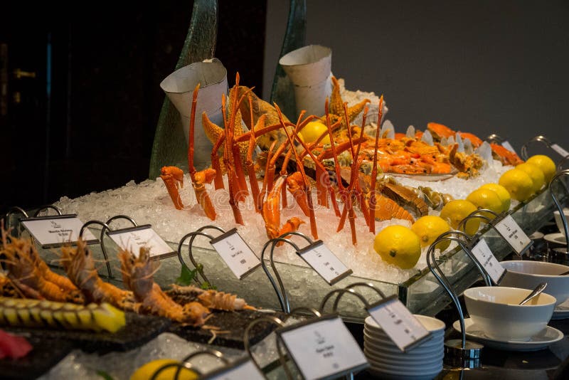 A Buffet of Seafood Such As Crab, Prawns and Crayfish on a Bed of ...