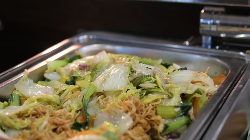 A Buffet Selection Featuring Various Asian Dishes, Including Stir-fried ...