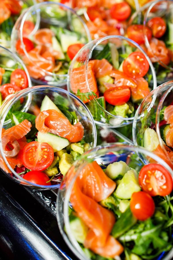 Buffet Table with Cups with Salad of Red Fish, Tomatoes, Cucumber Stock ...