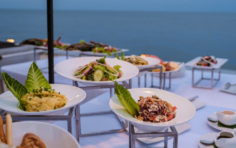 Buffet Table by the Ocean with Fresh Salad and Bread Stock Image ...