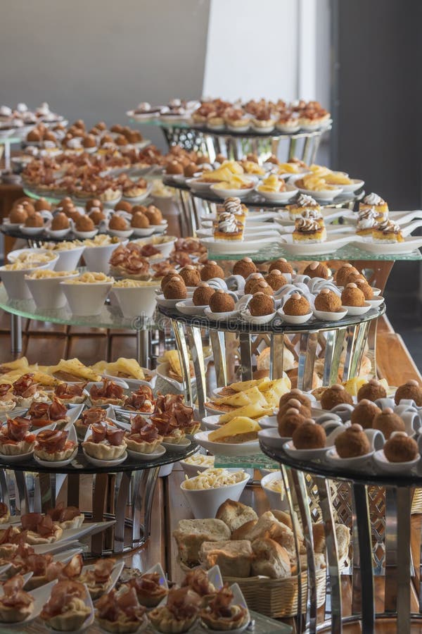 Buffet Table with the Plates of Desserts and Snacks, a Vertical Shot ...