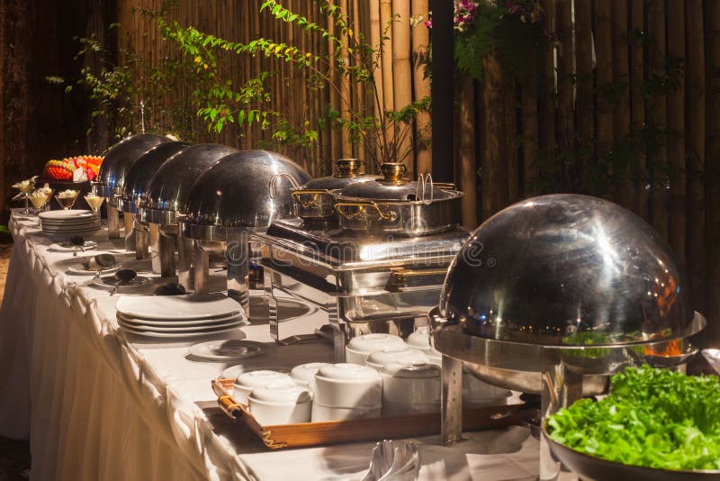 Buffet Table with Row of Food Service Steam Pans Stock Photo - Image of ...
