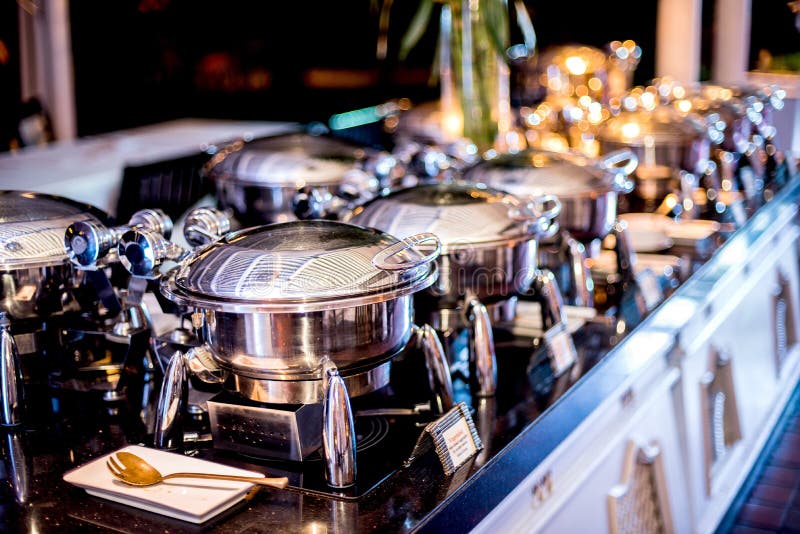 Buffet Table with Row of Food Service Steam Pans - Stock Image - Everypixel