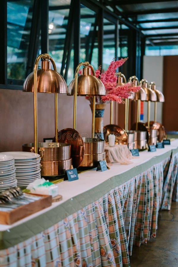 A Buffet Table Set Up with a Variety of Dishes for Guests Stock Photo ...
