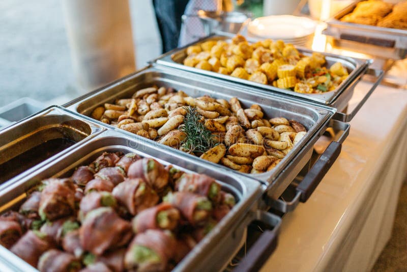 Buffet Table with Assorted Dishes in a Warm Setting. Stock Photo ...