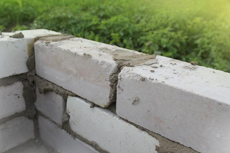 Build a brick wall stock image. Image of close, bricklayer - 44620223