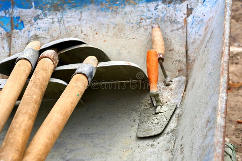 Scoop Shovels and Trowels in the Construction Wheelbarrow Stock Image ...