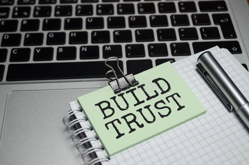 BUILD TRUST Text on Sticker on Blue Background with Pen and Keyboard ...