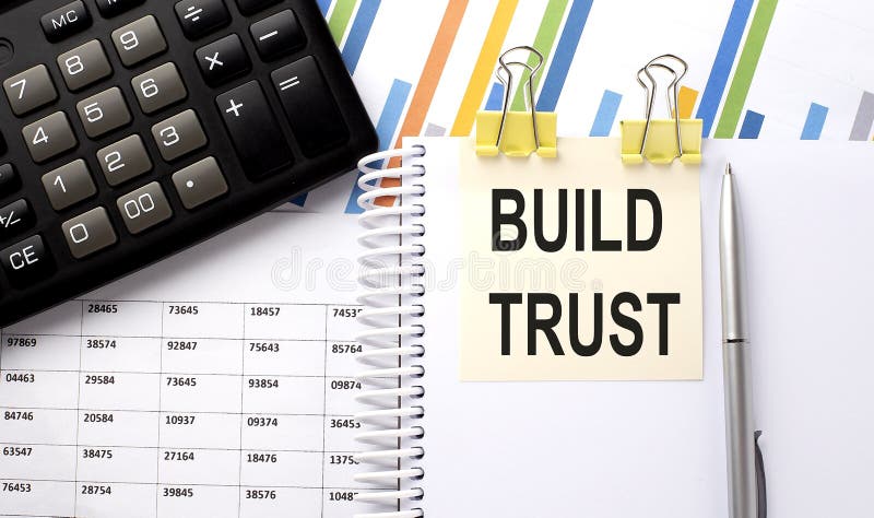 BUILD TRUST Text, Written on a Sticker with Calculator,pen on Chart ...