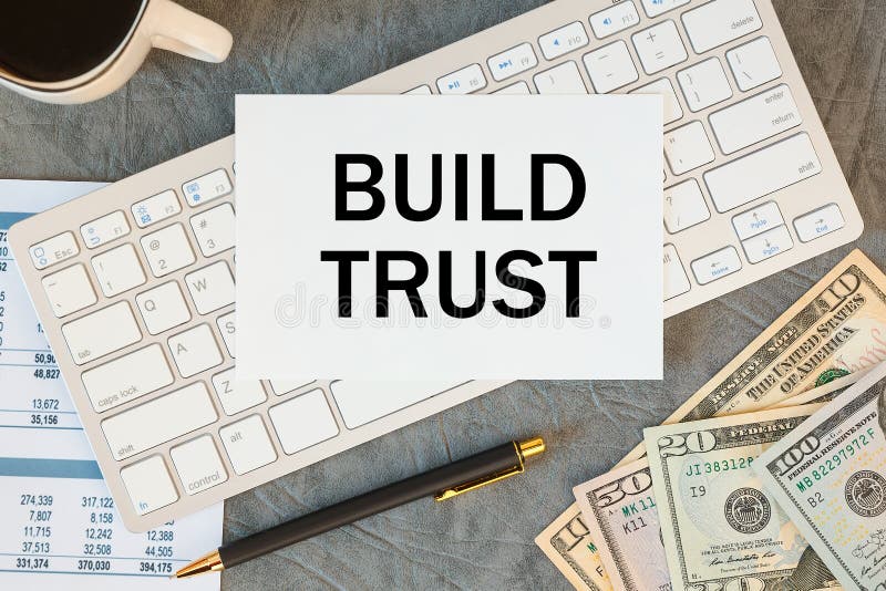 BUILD TRUST is Written in a Document on the Office Desk, Coffee, Money ...