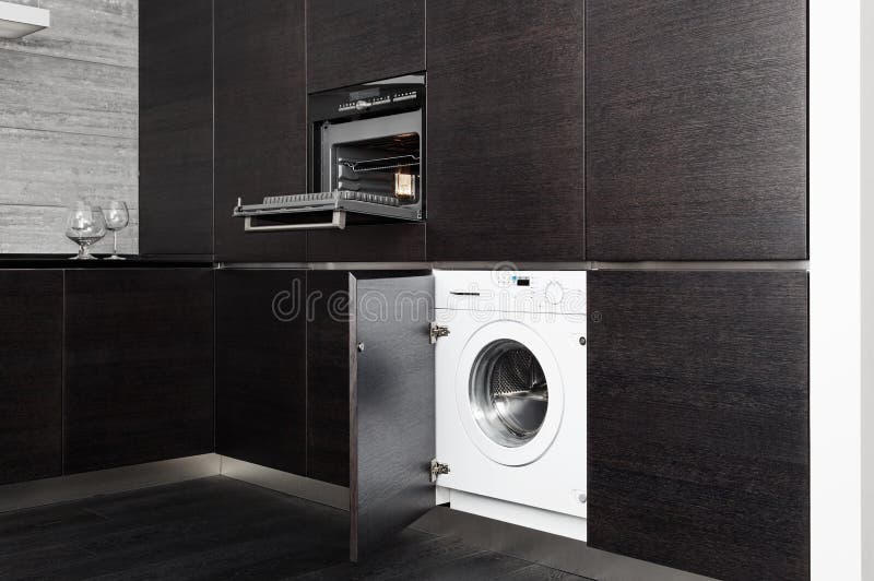 Build-in Washing Machine and Cooker on Kitchen Stock Image - Image of ...