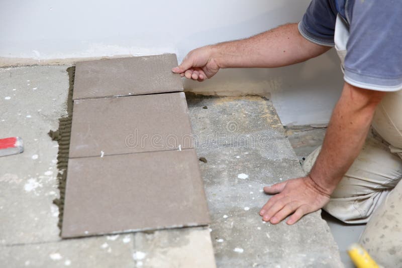The Builder Arranges Ceramic Tiles on the Stairs Inside the Building ...