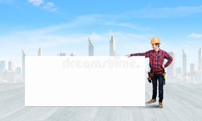 Builder with banner stock photo. Image of billboard, building - 45856224