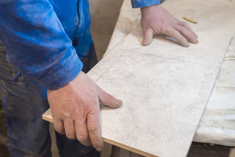 Builder Bricklayer Installs Ceramic Tiles. Apartment Renovation Stock ...