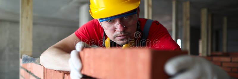 Builder Carefully Puts Red Brick on the Masonry Stock Image - Image of ...