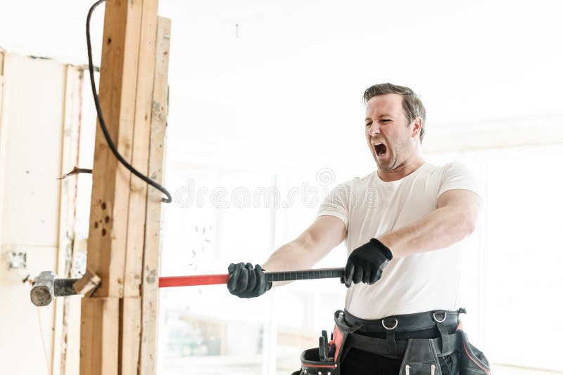 Builder Carpenter with Sledge Hammer Hit a Wall with Frustration Stock ...