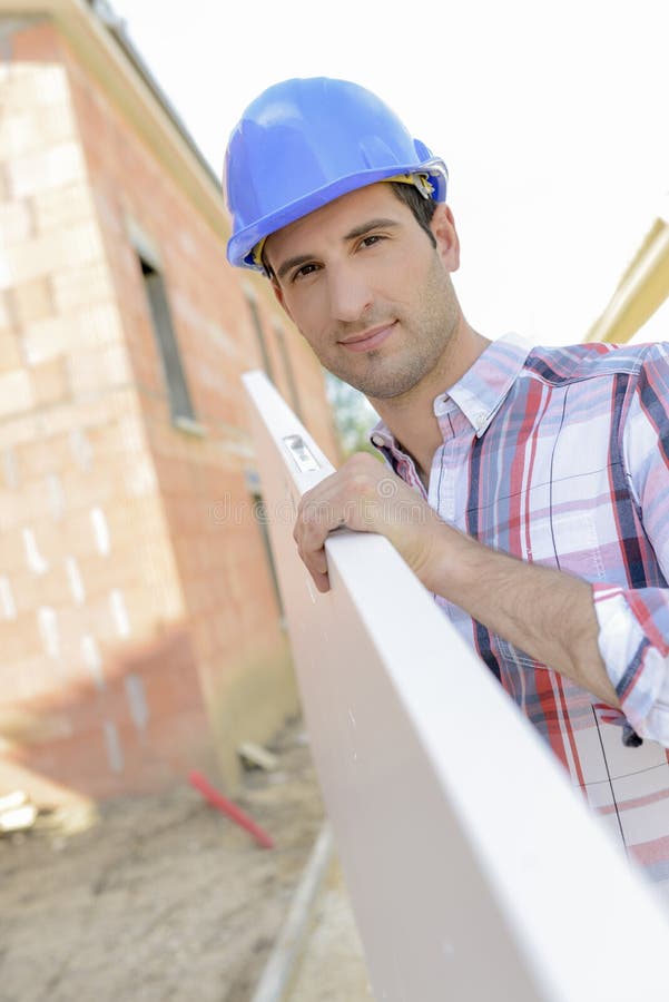 Builder Carrying Large Plank Wood Stock Photo - Image of building ...