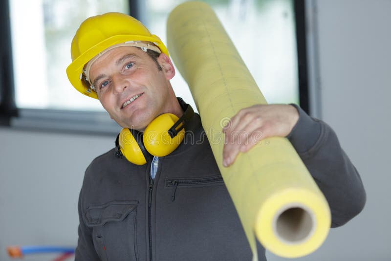 Builder Carrying Roll Paper Stock Image - Image of construction, loft ...