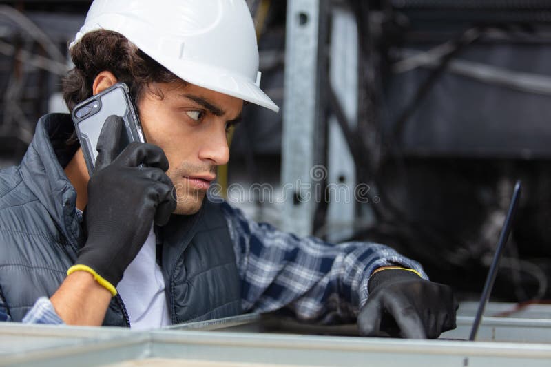 Builder on Cell Phone in Ceiling Stock Image - Image of metallic ...