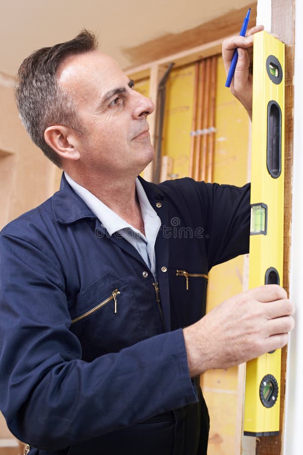 Builder Checking Work with Spirit Level Stock Image - Image of building ...