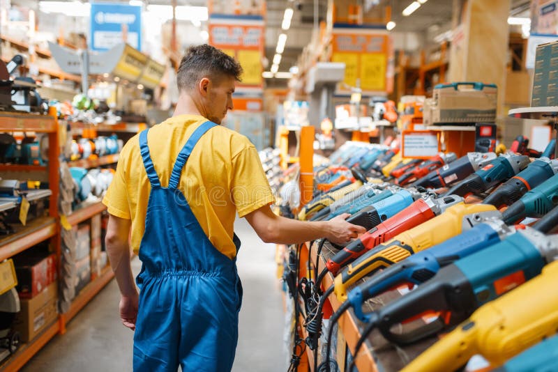 Builder Choosing Angle Grinder in Hardware Store Stock Photo - Image of ...