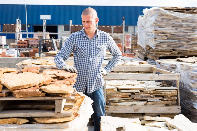 Builder is Choosing Natural Facing Stone in Building Store Stock Photo ...