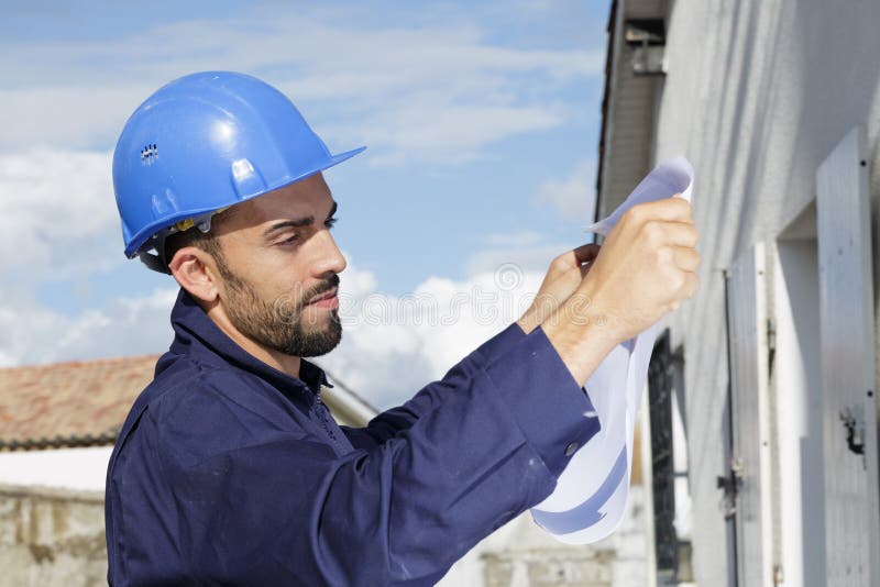 Builder with Construction Plan Outdoors Stock Photo - Image of latin ...