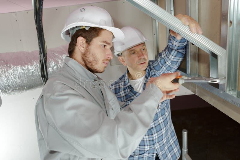 Builder on Construction Site Stock Photo - Image of orange, effort ...