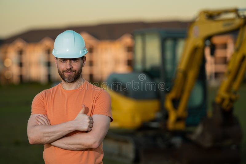 Builder in a Construction Site. Builder with Excavator Ready To Build ...