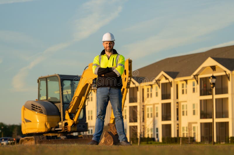 Builder in a Construction Site. Builder with Excavator Ready To Build ...