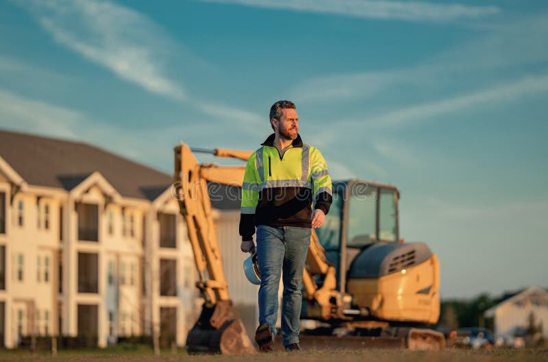 Builder in a Construction Site. Builder with Excavator Ready To Build ...