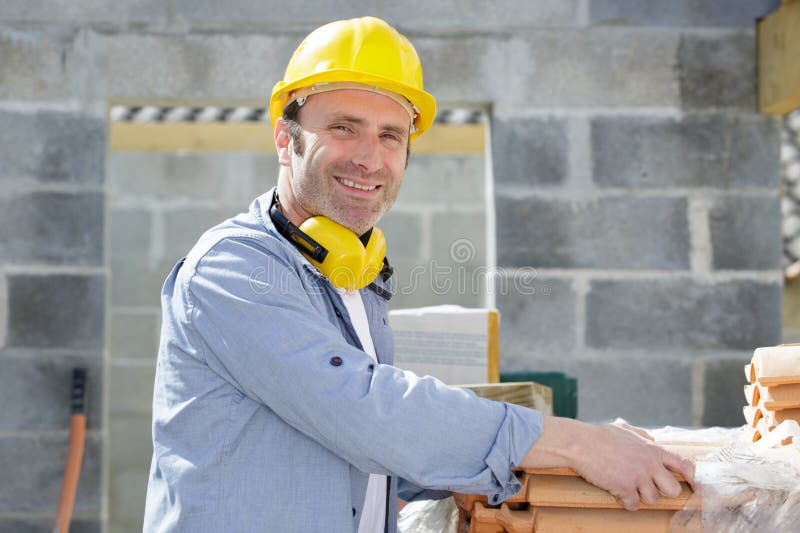 Builder on Construction Site Checking Outdoor Stock Photo - Image of ...