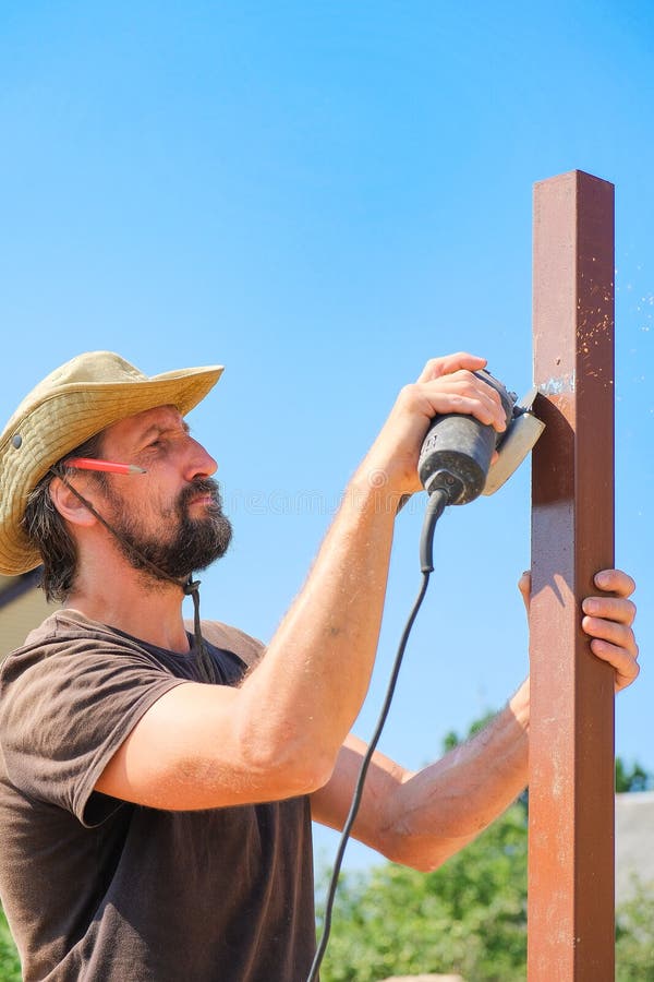 Builder on the Construction Site Cutting Metal Grinder Stock Photo ...