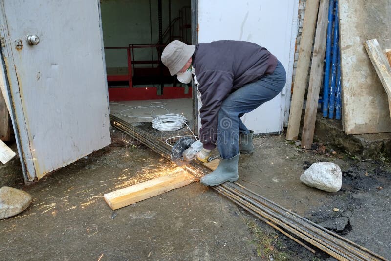 Builder Cuts Metal Cutting Machine Stock Photo - Image of construction ...