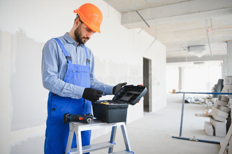 Builder on Construction Site with Tool Box Stock Photo - Image of ...