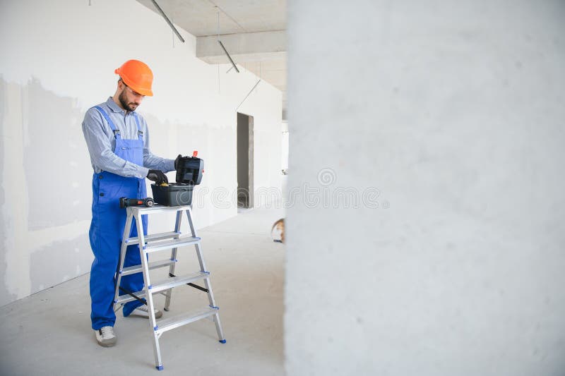 Builder on Construction Site with Tool Box Stock Photo - Image of ...